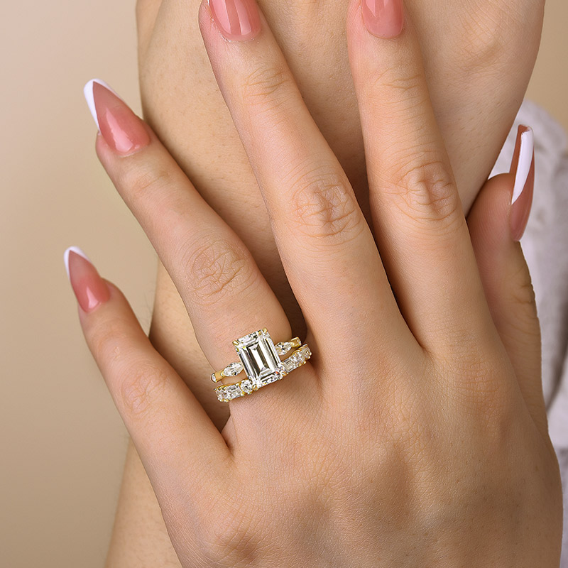 Three stone emerald cut diamond ring with wedding band store